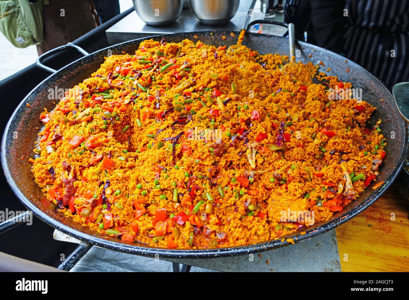 Giant vegetarian rice paella dish in a traditional pan Stock Photo - Alamy