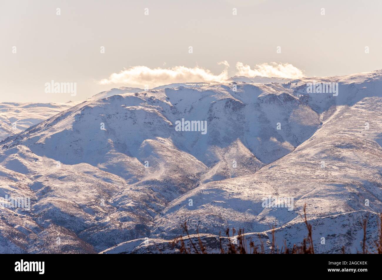 Beautiful low angle shot of a breathtaking mountainous scenery covered ...