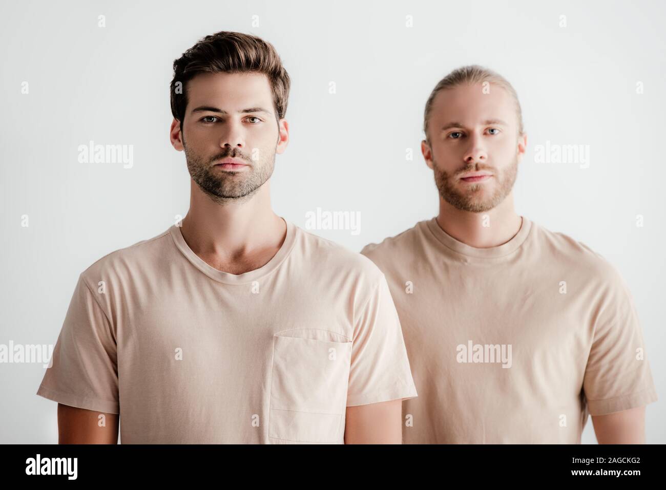 young handsome men in beige outfit isolated on white Stock Photo - Alamy
