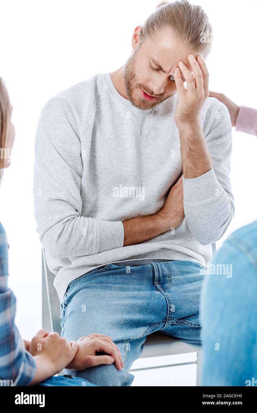 support group helping sad man on chair isolated on white Stock Photo ...