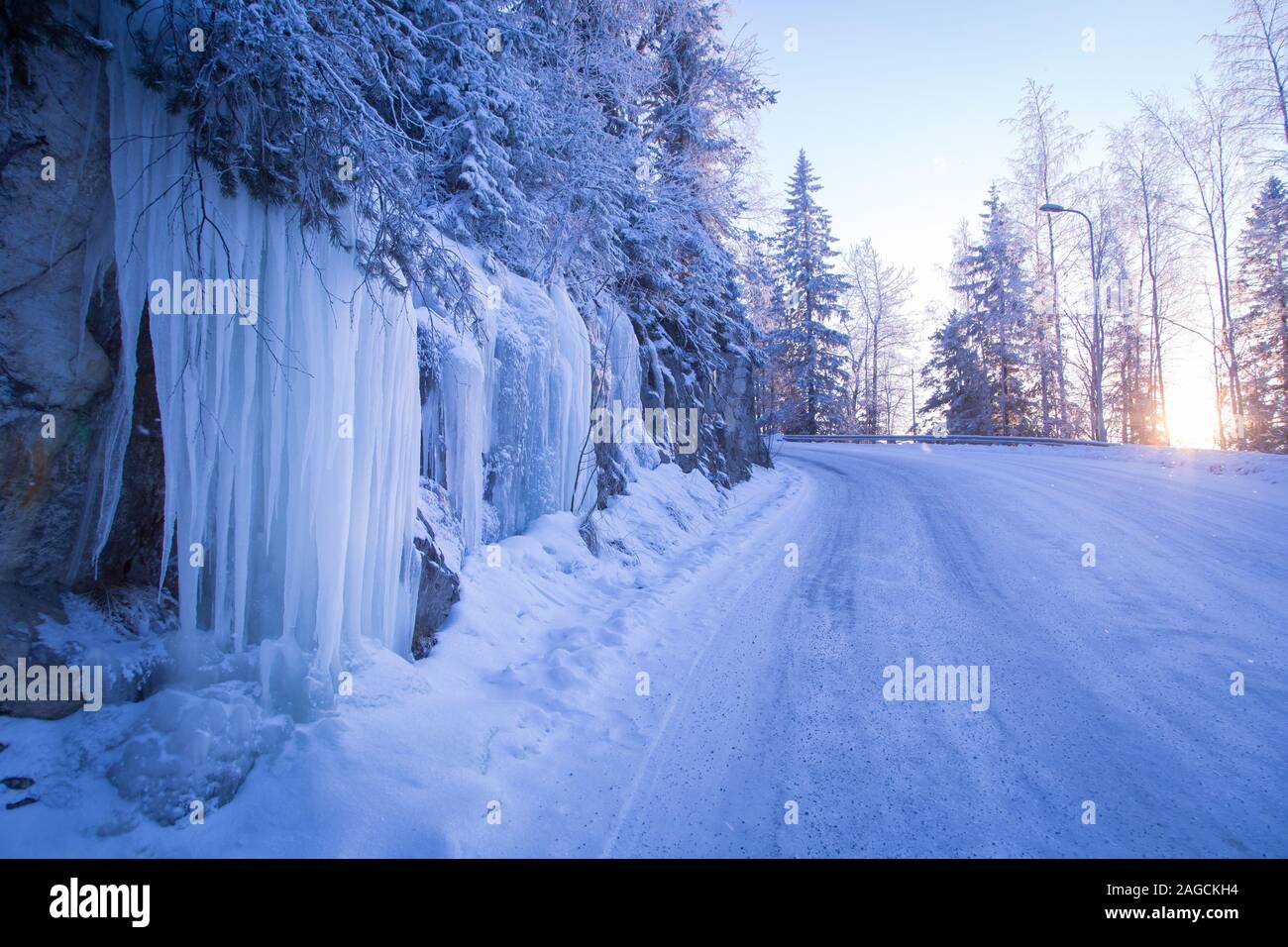 Large icecycles hanging from a cliff wall outside in the winter Stock ...