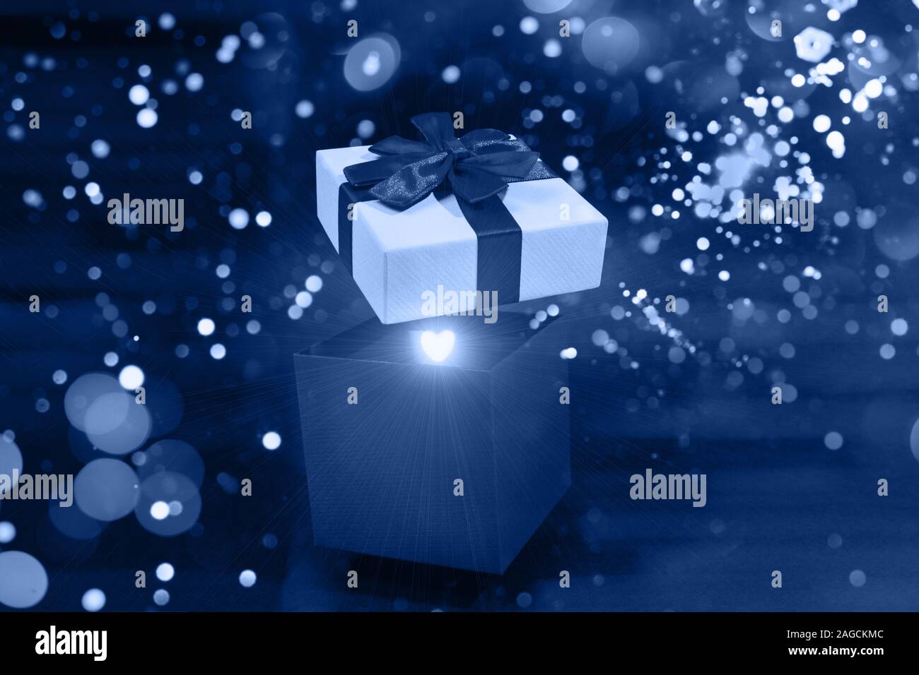 Open magic gift box dark background Stock Photo - Alamy