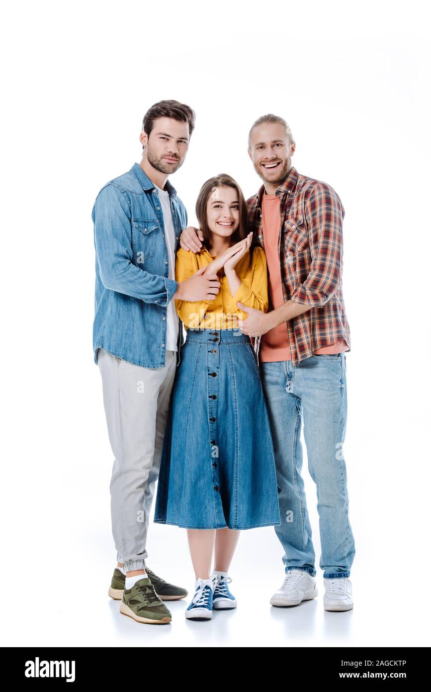 full length view of happy three young friends hugging isolated on white ...