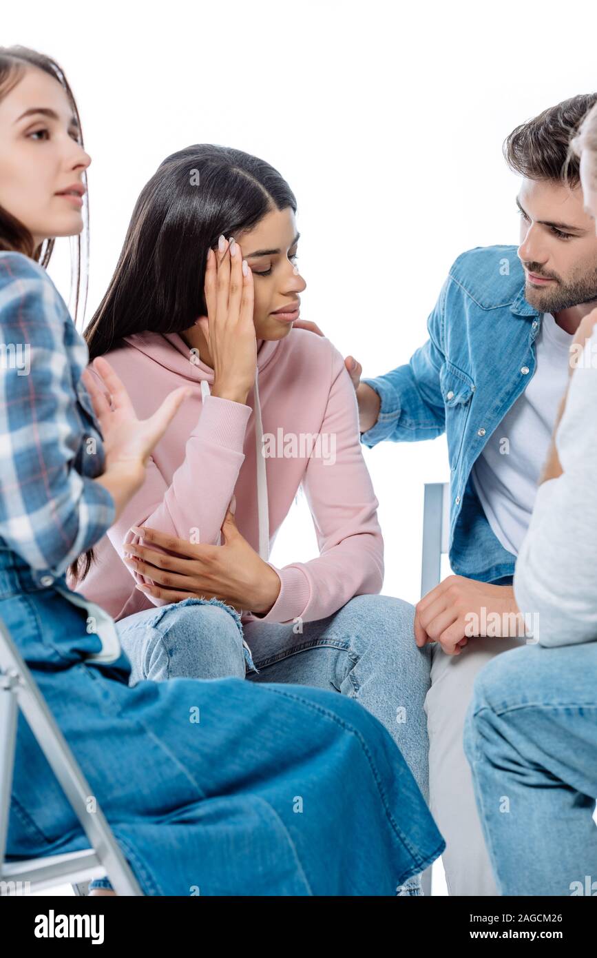 support group helping sad african american girl on chair isolated on ...