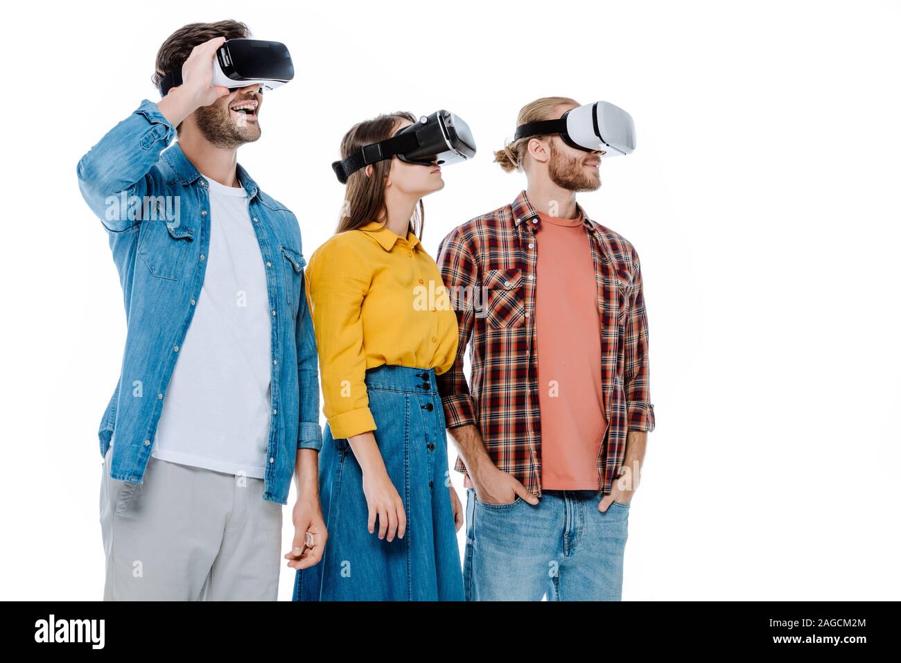 excited three young friends in vr headsets isolated on white Stock ...