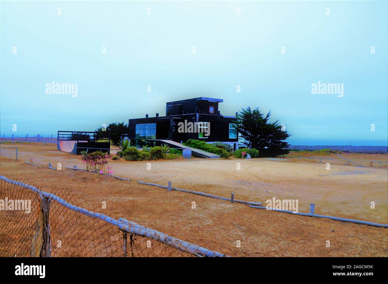 Modern black building with trendy architectural twists at the ocean ...