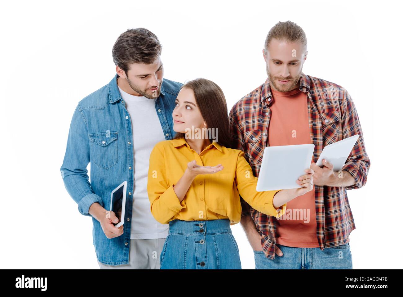 three young friends using digital tablets isolated on white Stock Photo ...