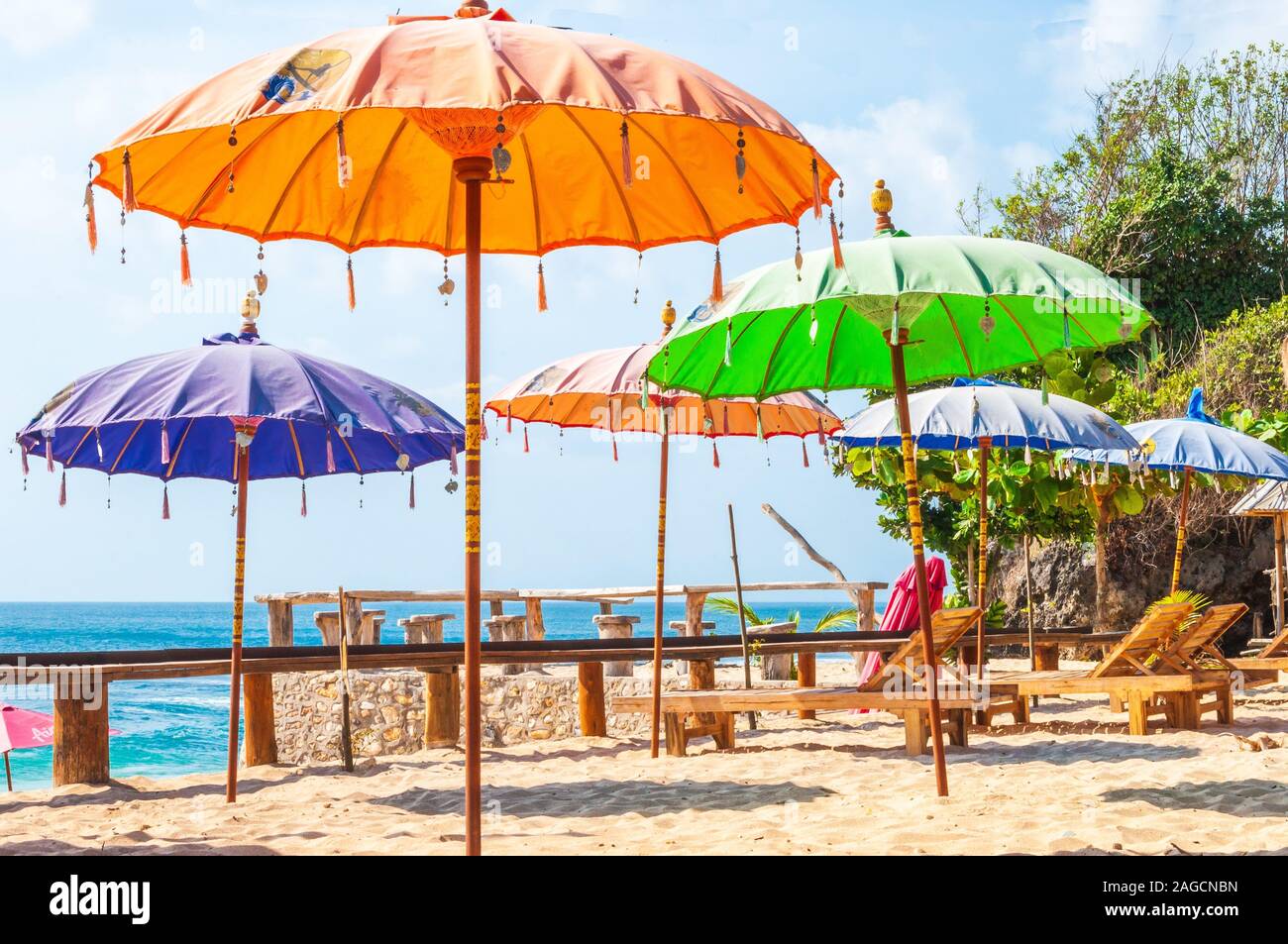 Group of umbrellas in vibrant colors standing at the beach in Bali ...