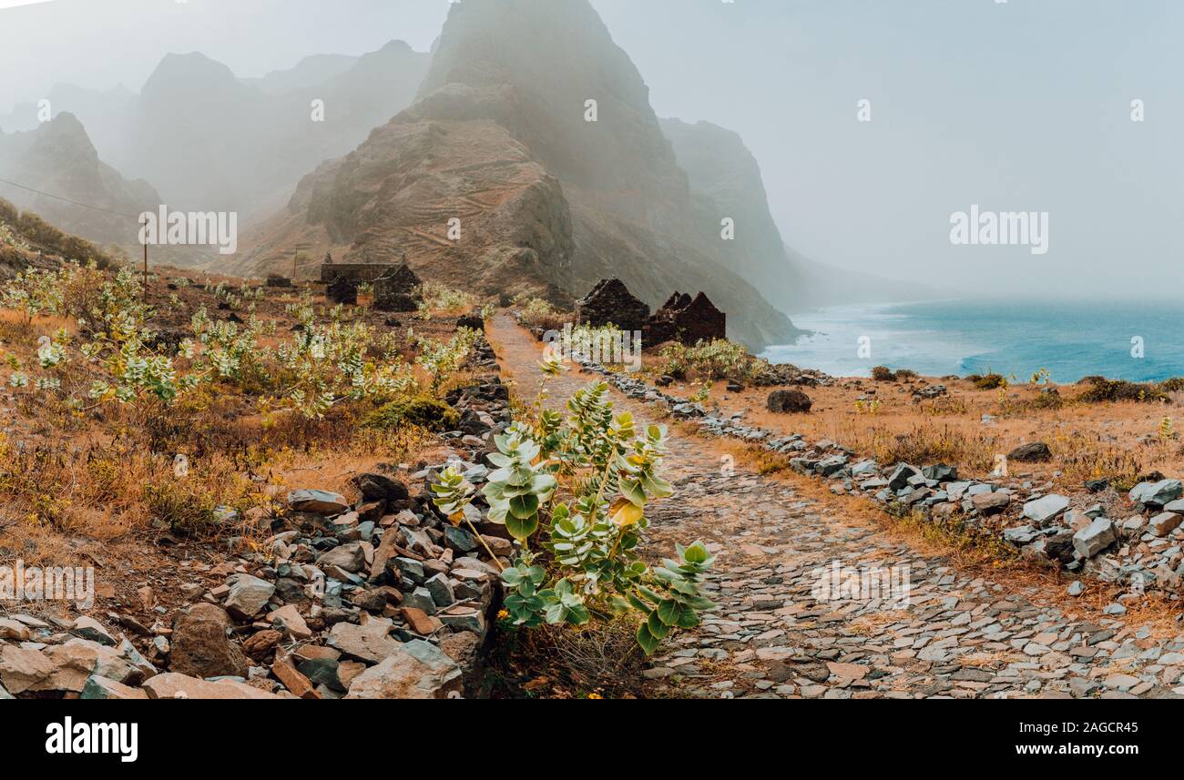 Panoramic view of stony hiking path to Ponta do Sol over amazing arid ...