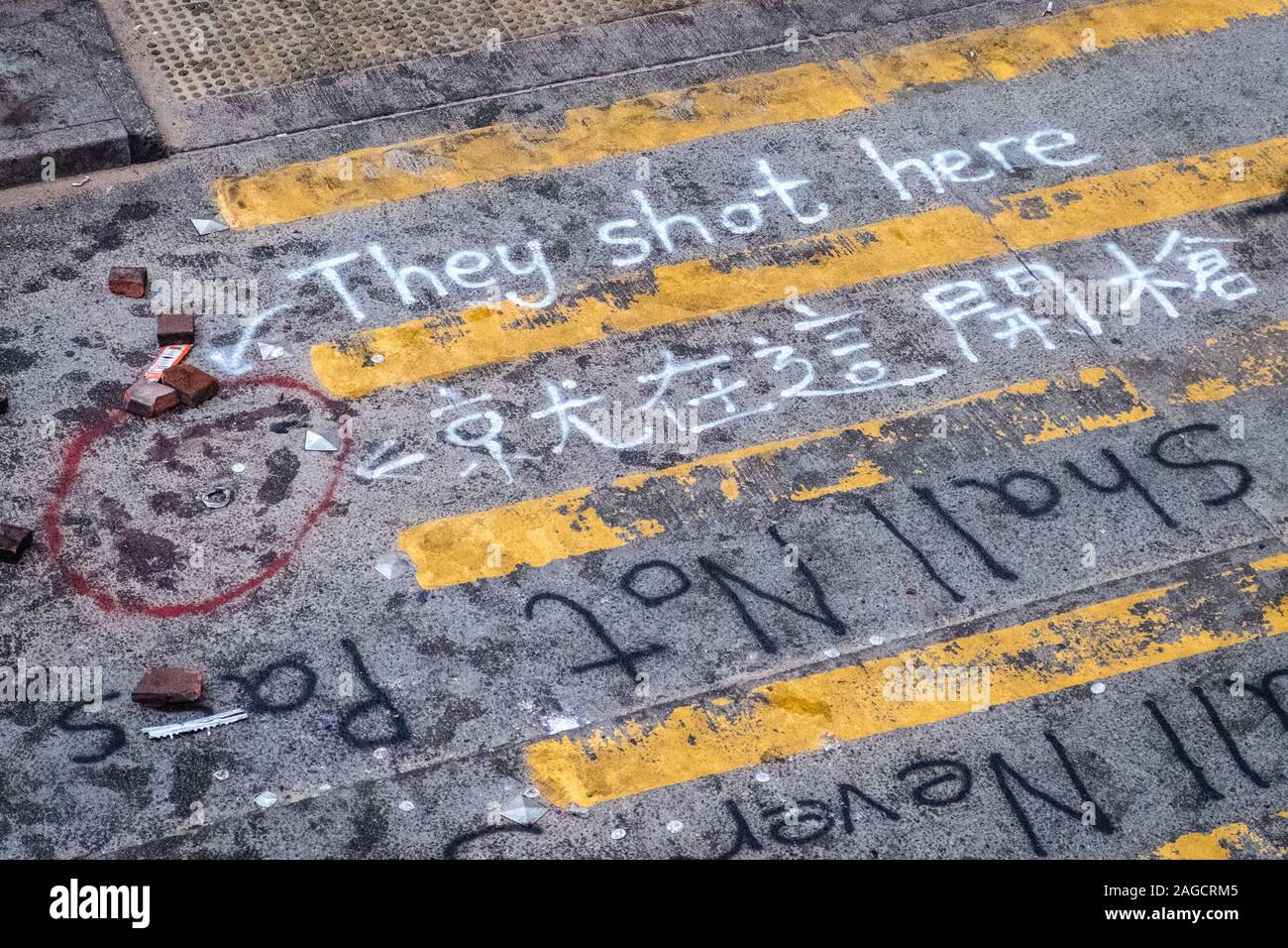 HongKong - November 11, 2019: Graffiti on floor reading "They shot here ...