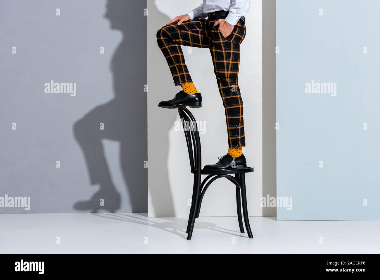 Man standing by chair hi-res stock photography and images - Alamy