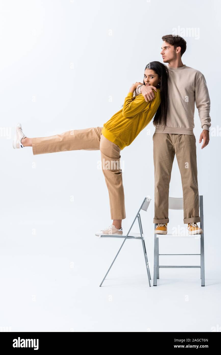 Man standing on chair hi-res stock photography and images - Alamy