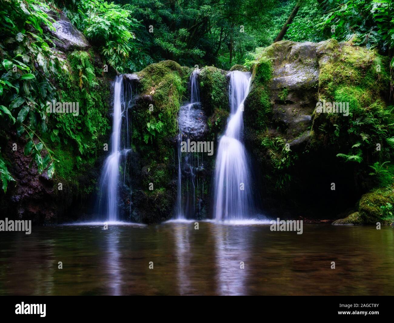 Long exposure image of beautiful waterfall in tropical environment ...
