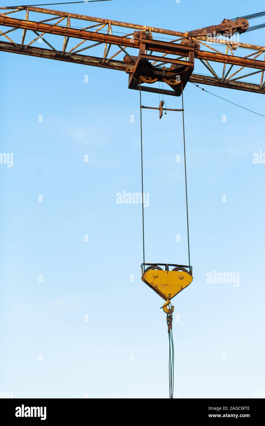Old rusty construction crane at a construction site Stock Photo - Alamy