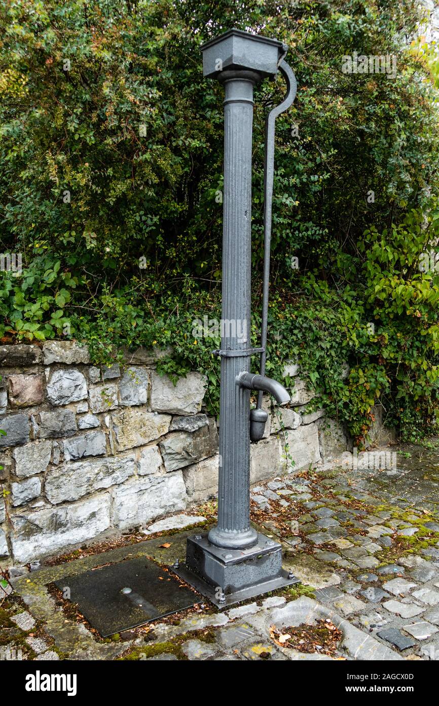 Black metal water pump with handle on well. Breinig-Stolberg (Rheinland ...