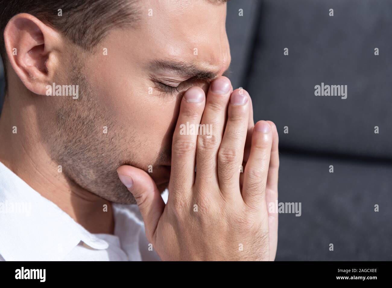 depressed man crying in living room at home Stock Photo - Alamy
