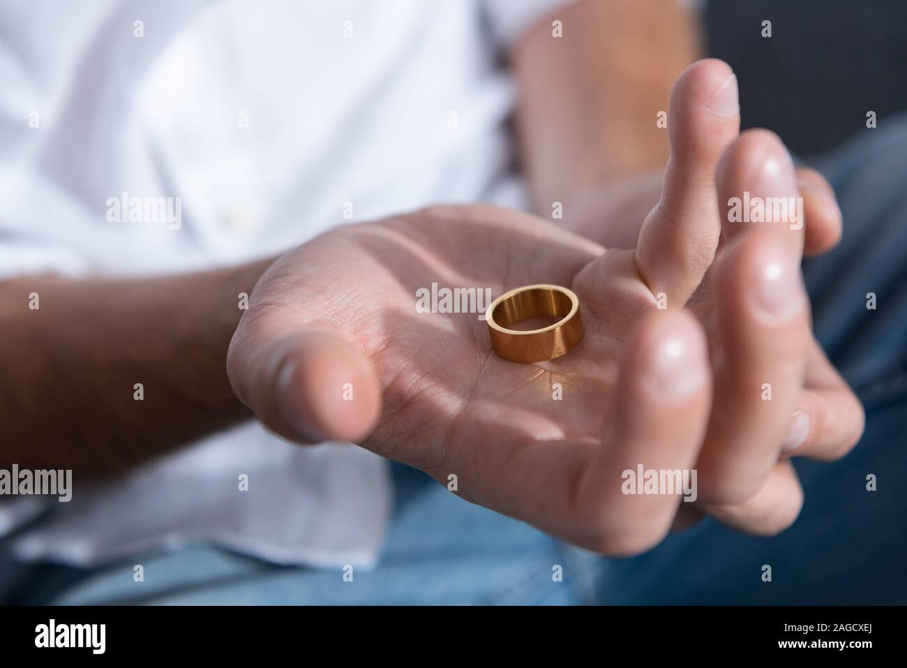 partial view of man holding ring at home Stock Photo - Alamy
