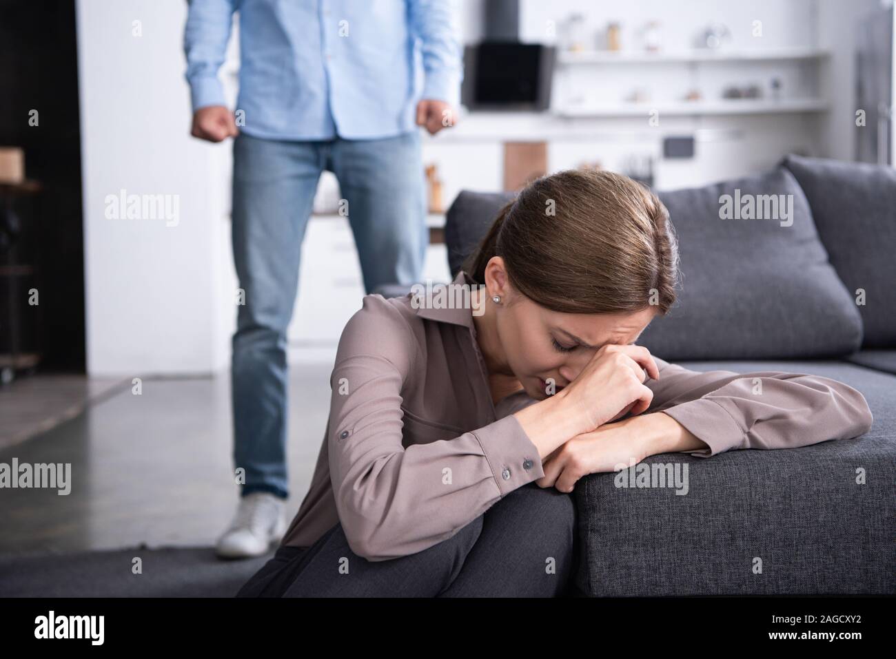 partial view of man and upset crying woman at home Stock Photo - Alamy