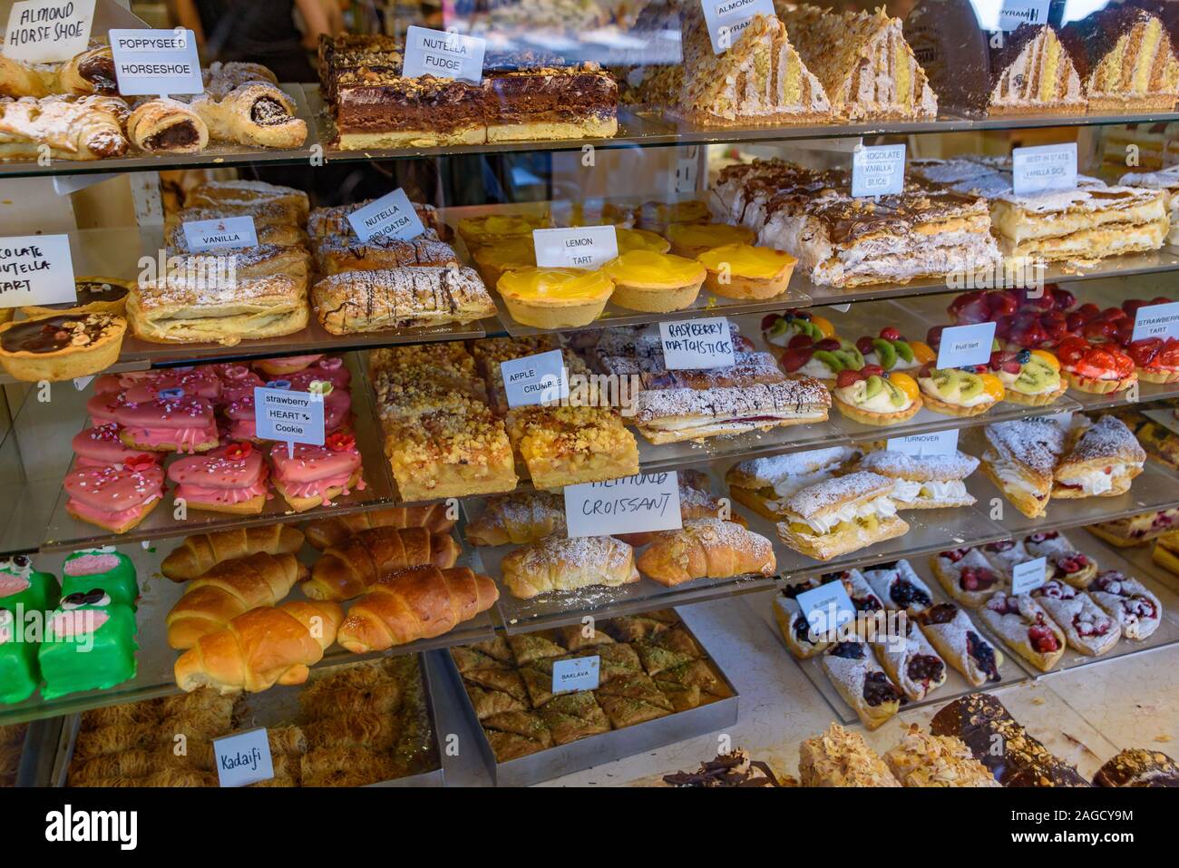 Desserts and cakes in window Stock Photo - Alamy