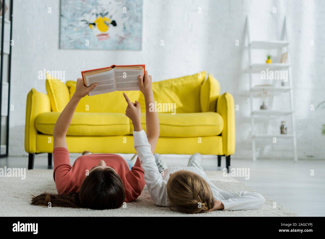Pointing book child hi-res stock photography and images - Alamy