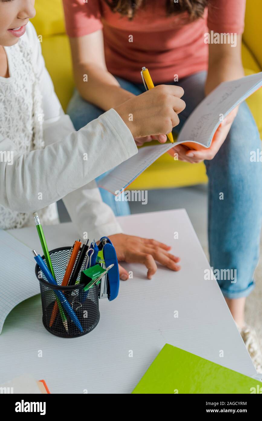 Kid holding pencils and notebooks hi-res stock photography and images ...