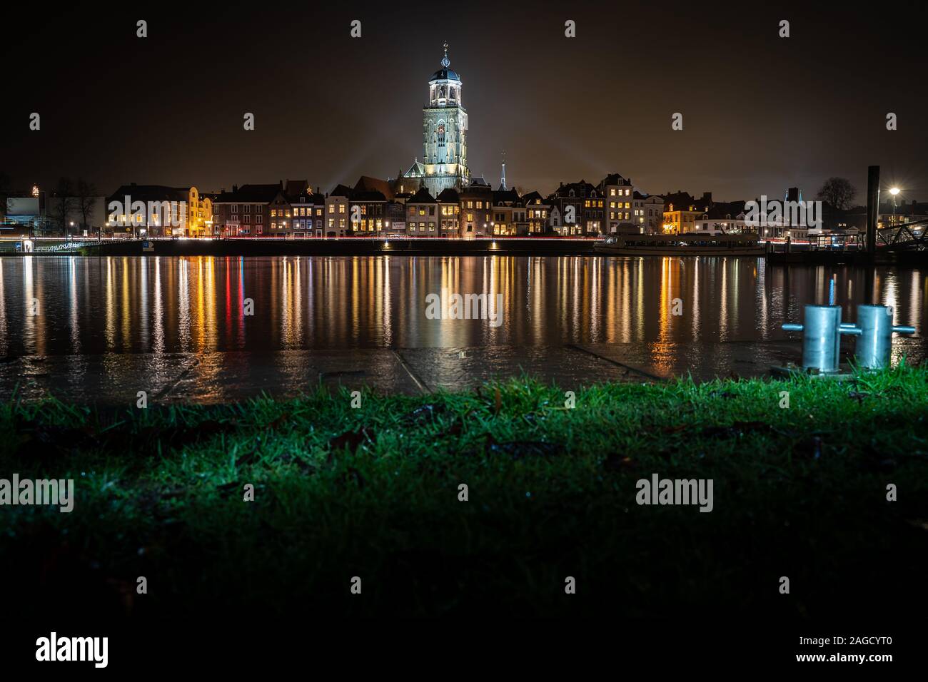 View of medieval Dutch city with the Great Church alongside the IJssel ...