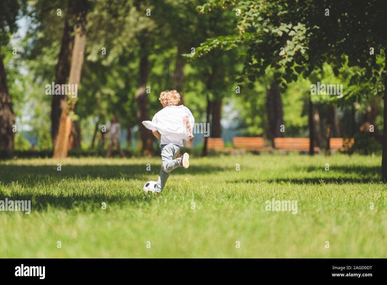 Boy playing football in hi-res stock photography and images - Alamy