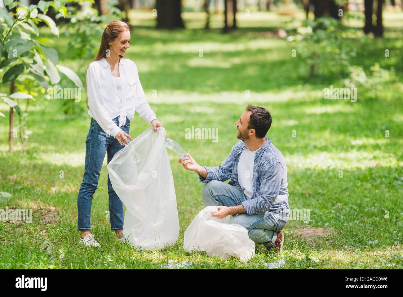 People picking up garbage in park hi-res stock photography and images ...
