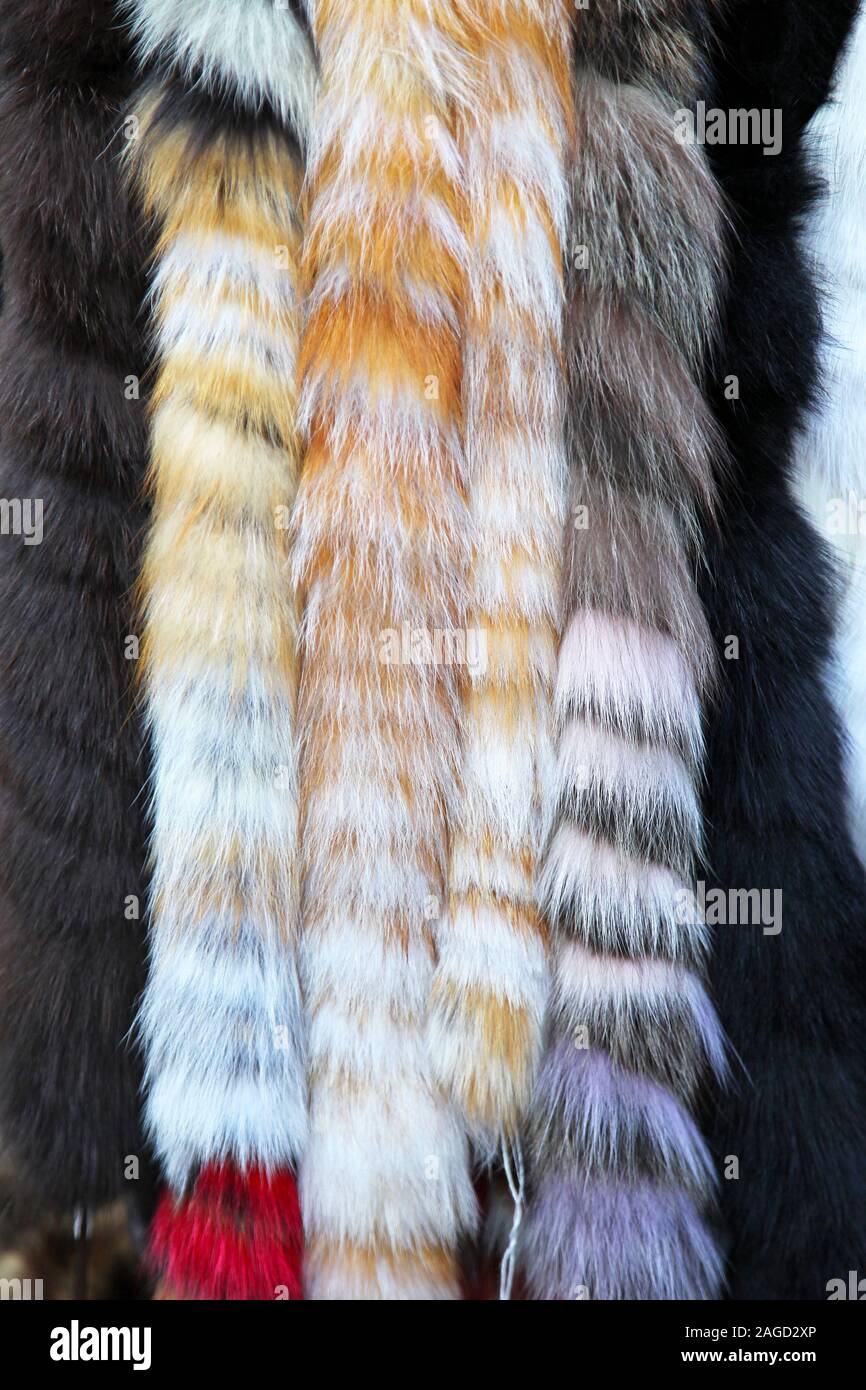Modern fur tail shawls at display Stock Photo - Alamy