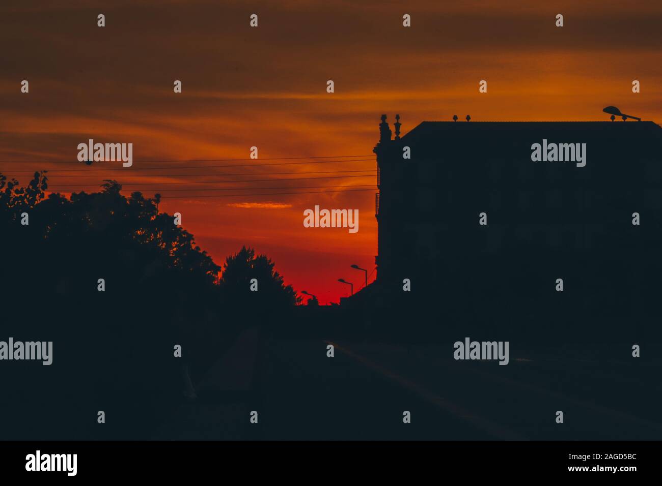 Silhouette of a convent at sunset Stock Photo - Alamy