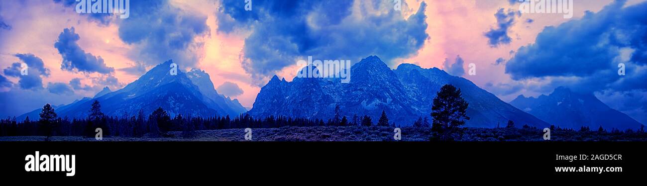 Panorama of a mesmerizing mountainous scenery under the cloudy sky with ...