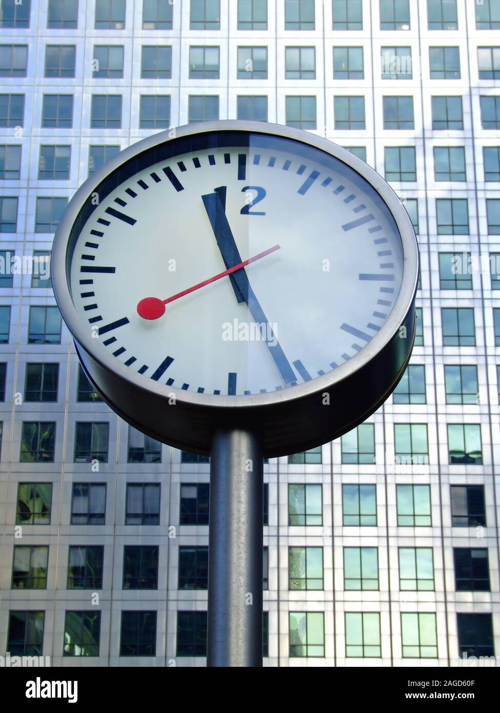 Bussines clock in front of office building Stock Photo - Alamy