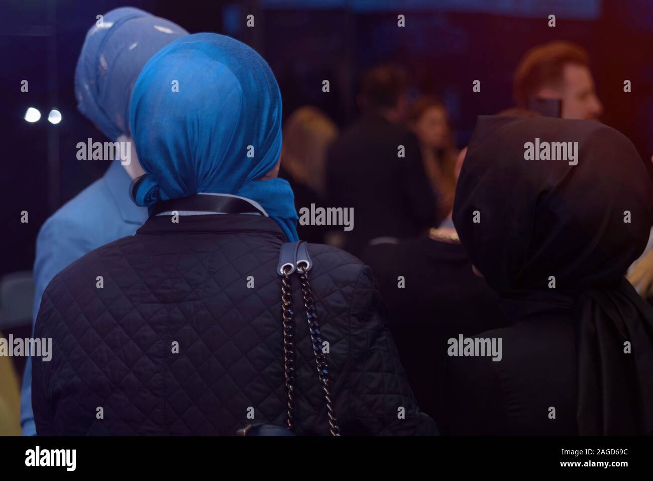 Business muslim woman as leader speaking at Conference. Audience at the ...