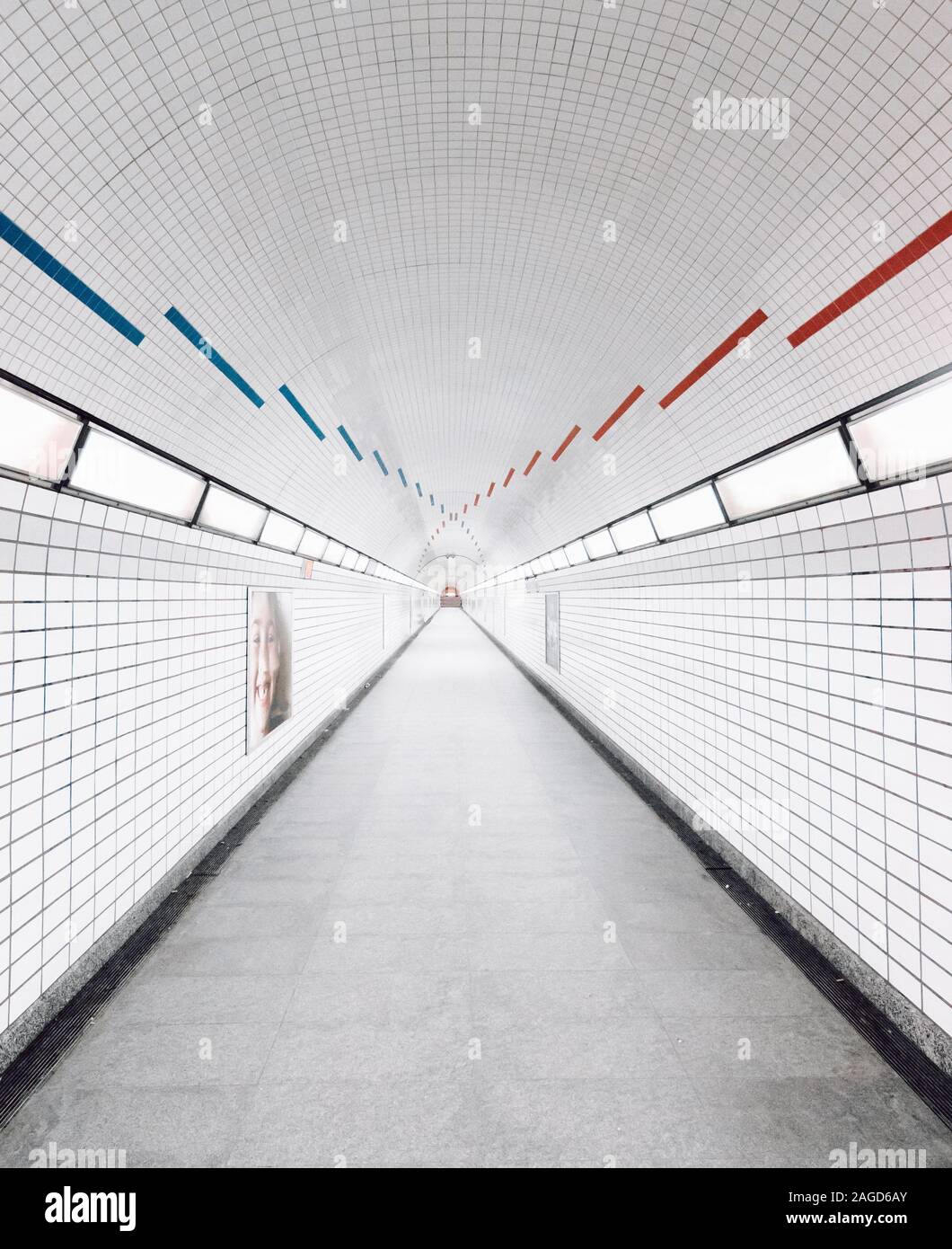 Vertical shot of the interior of a hallway in the subway station in New ...