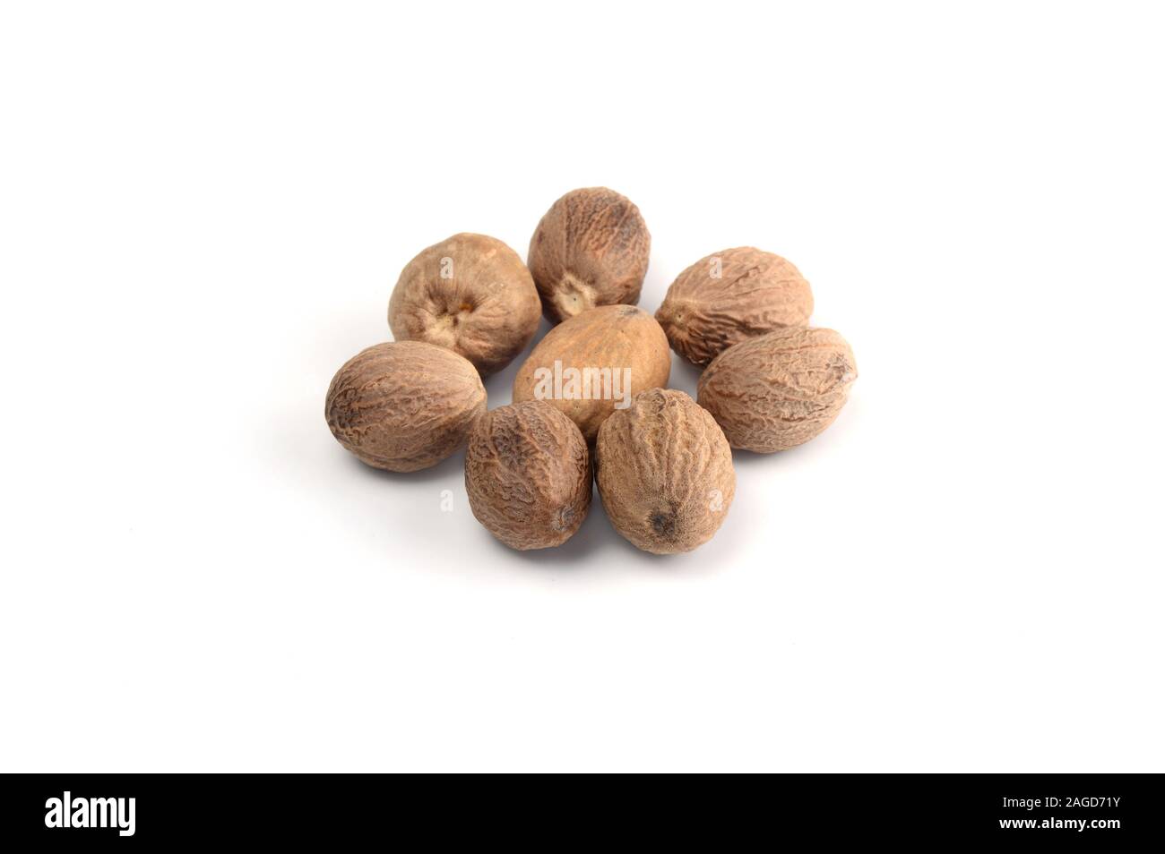 Nutmeg isolated on white background. Close up Stock Photo - Alamy