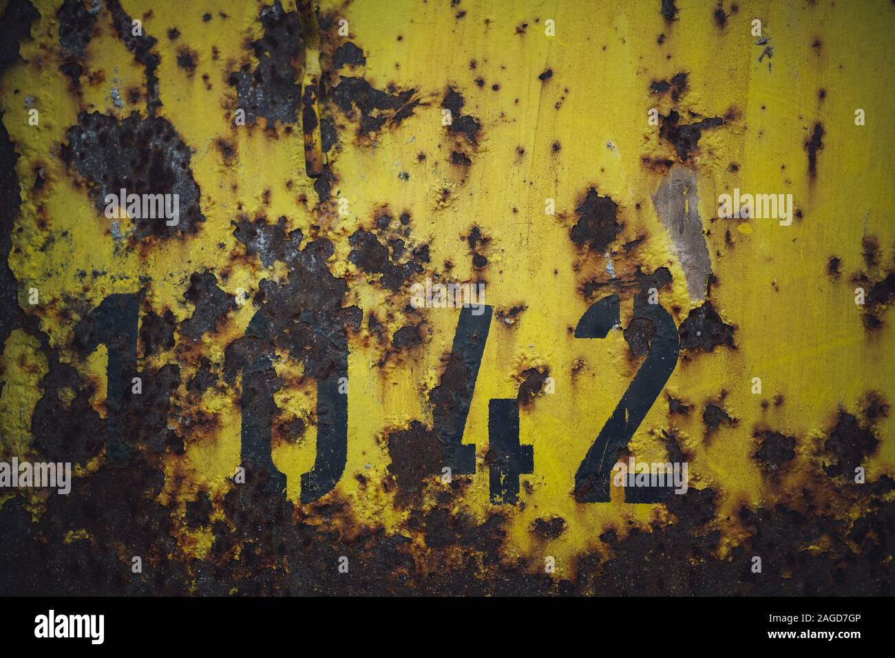 Closeup of black numbers on a rusty yellow metal - a cool picture for ...
