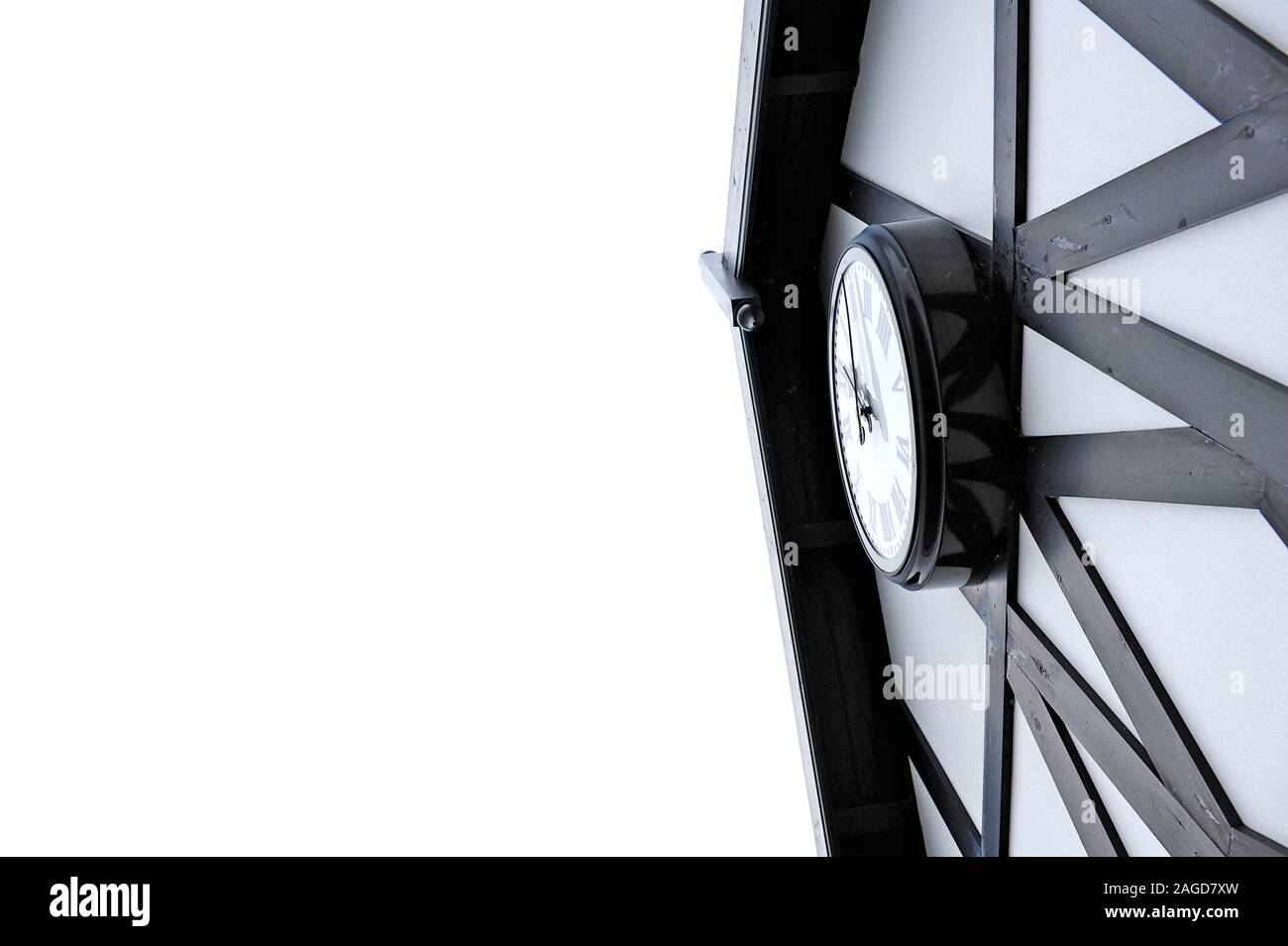 Black and white clock on external wall of Tudor style building Stock ...