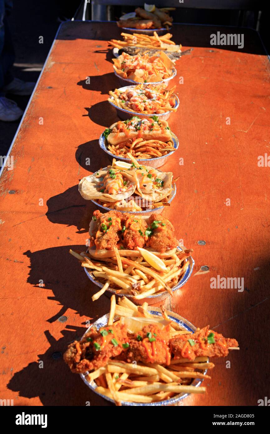 Selection of fried food on display from the menu of a food truck at the ...