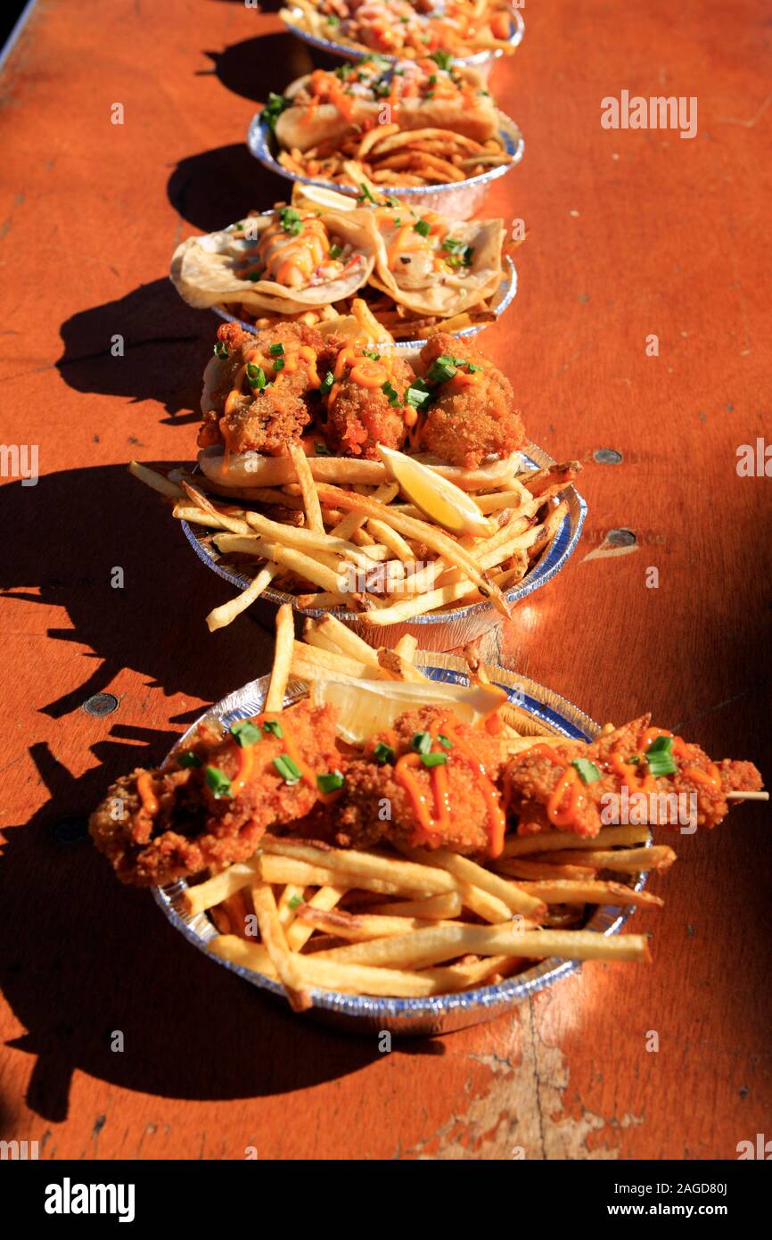 Selection of fried food on display from the menu of a food truck at the ...