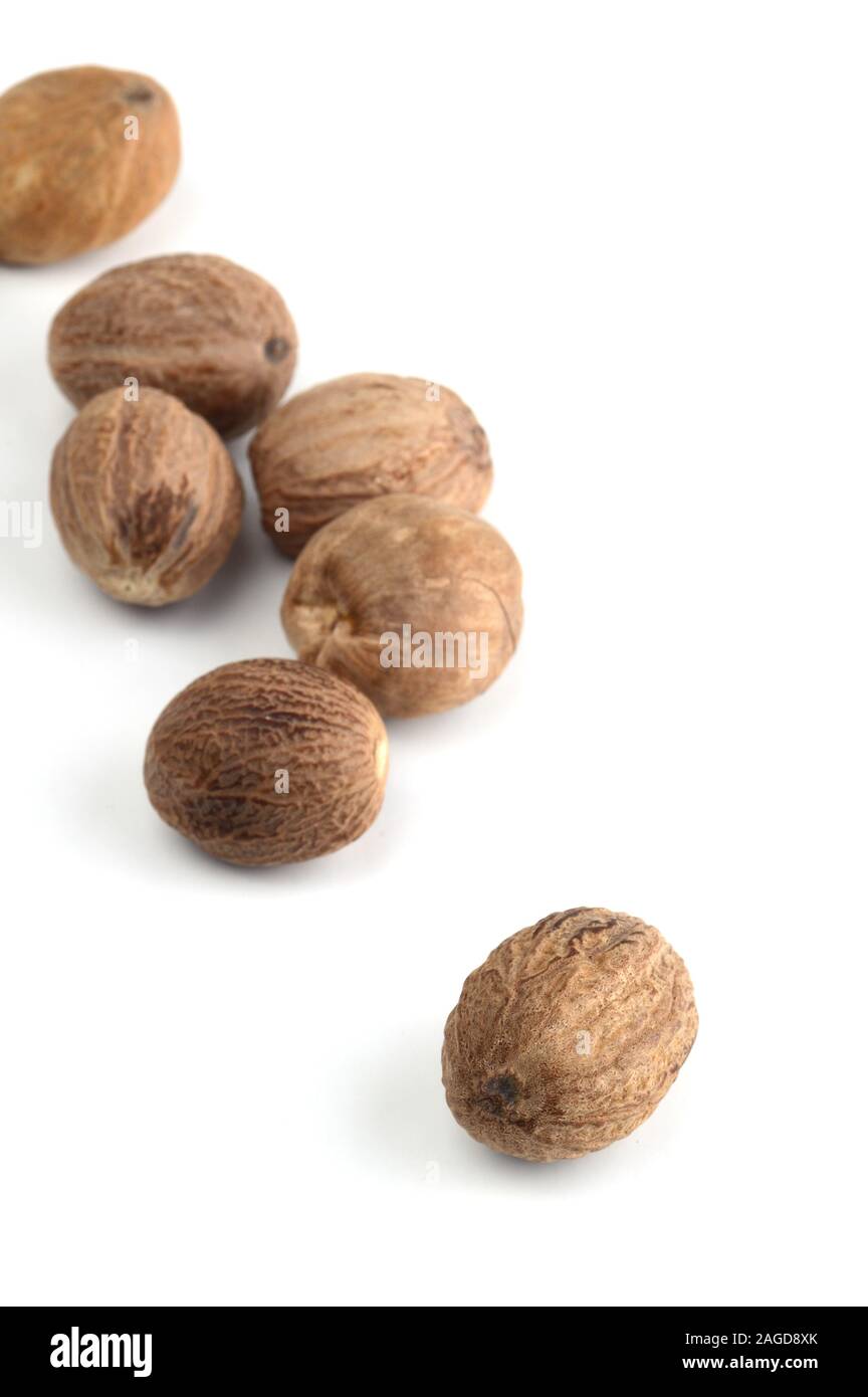 Nutmeg isolated on white background. Close up Stock Photo - Alamy