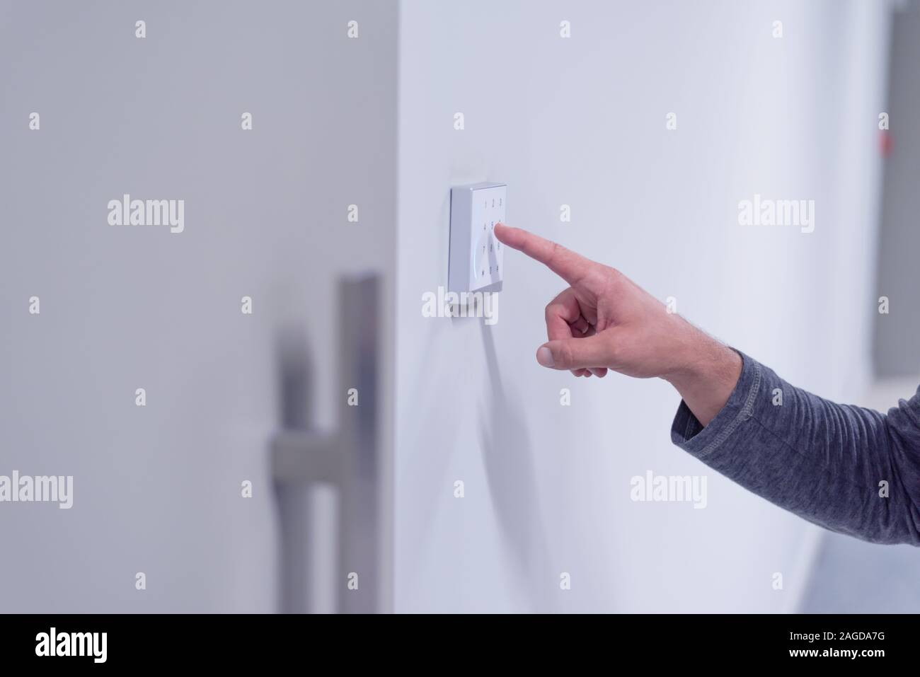 Young businessman entering access code at building entrance. The smart ...