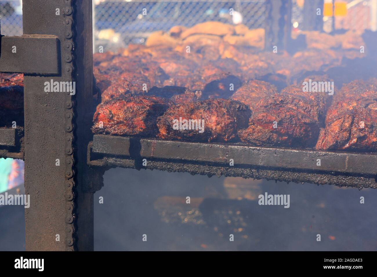 Slabs of tri-tip beef being cooked by a food vendor at the historic ...
