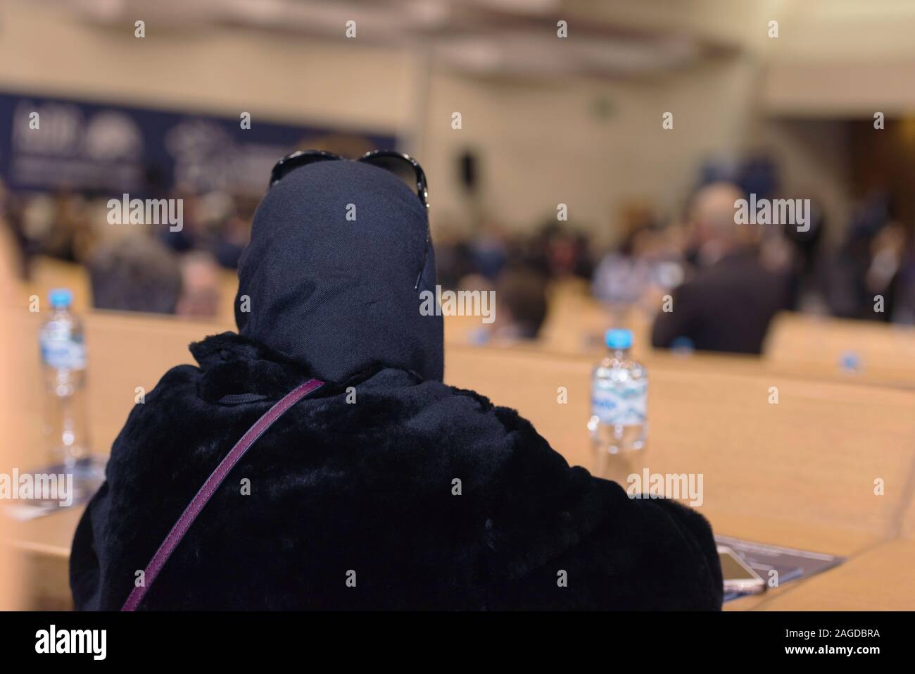 Muslim Business woman at business conference room with public giving ...