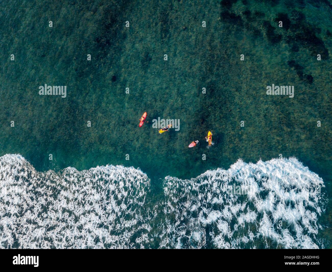 Aerial view of surfers in the ocean Stock Photo - Alamy