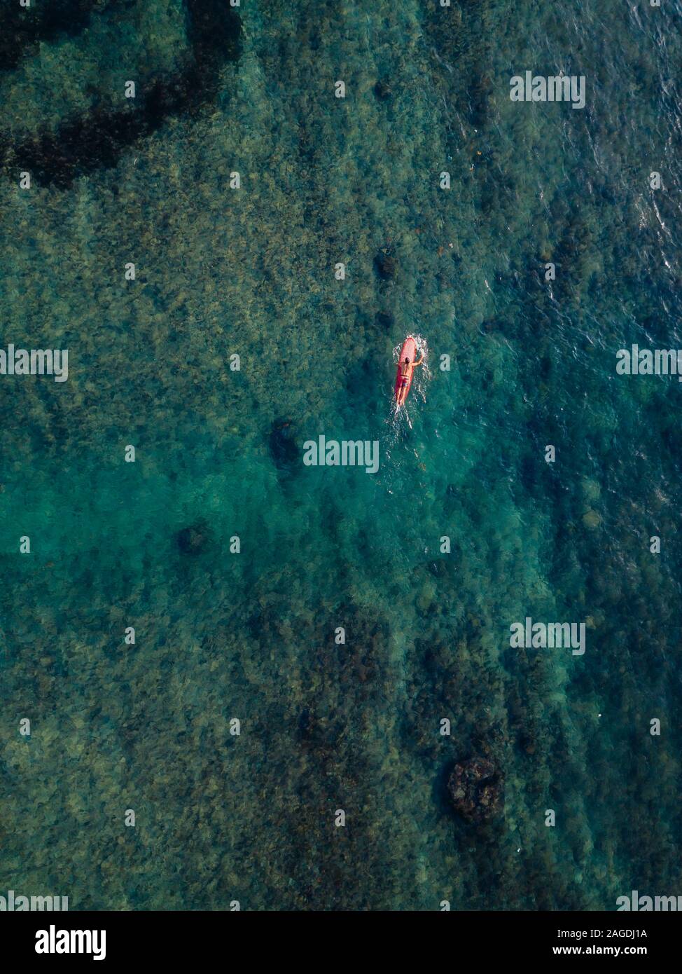 Aerial view of surfer in the ocean Stock Photo - Alamy
