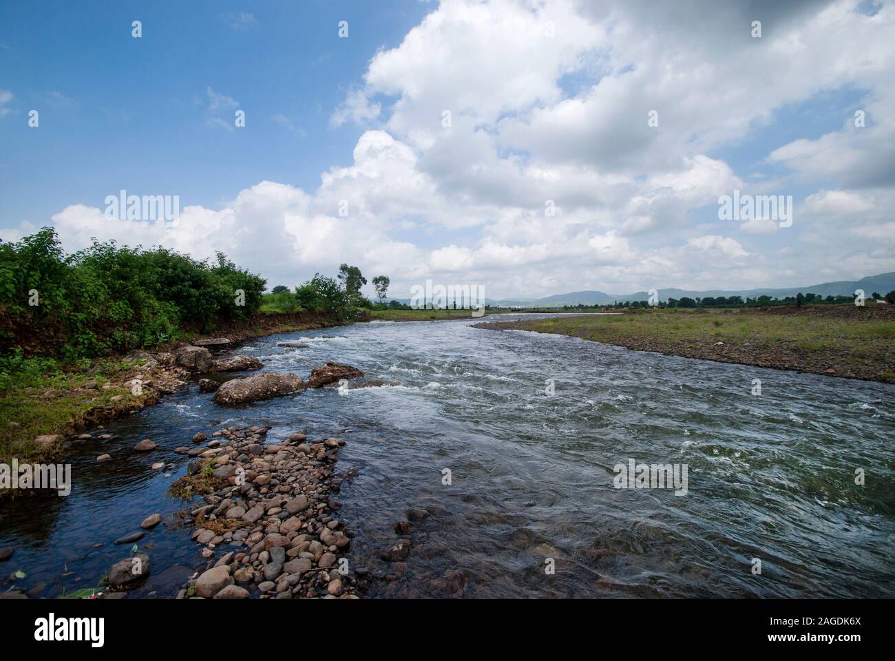 landscape with mountains trees and a river in front Stock Photo - Alamy