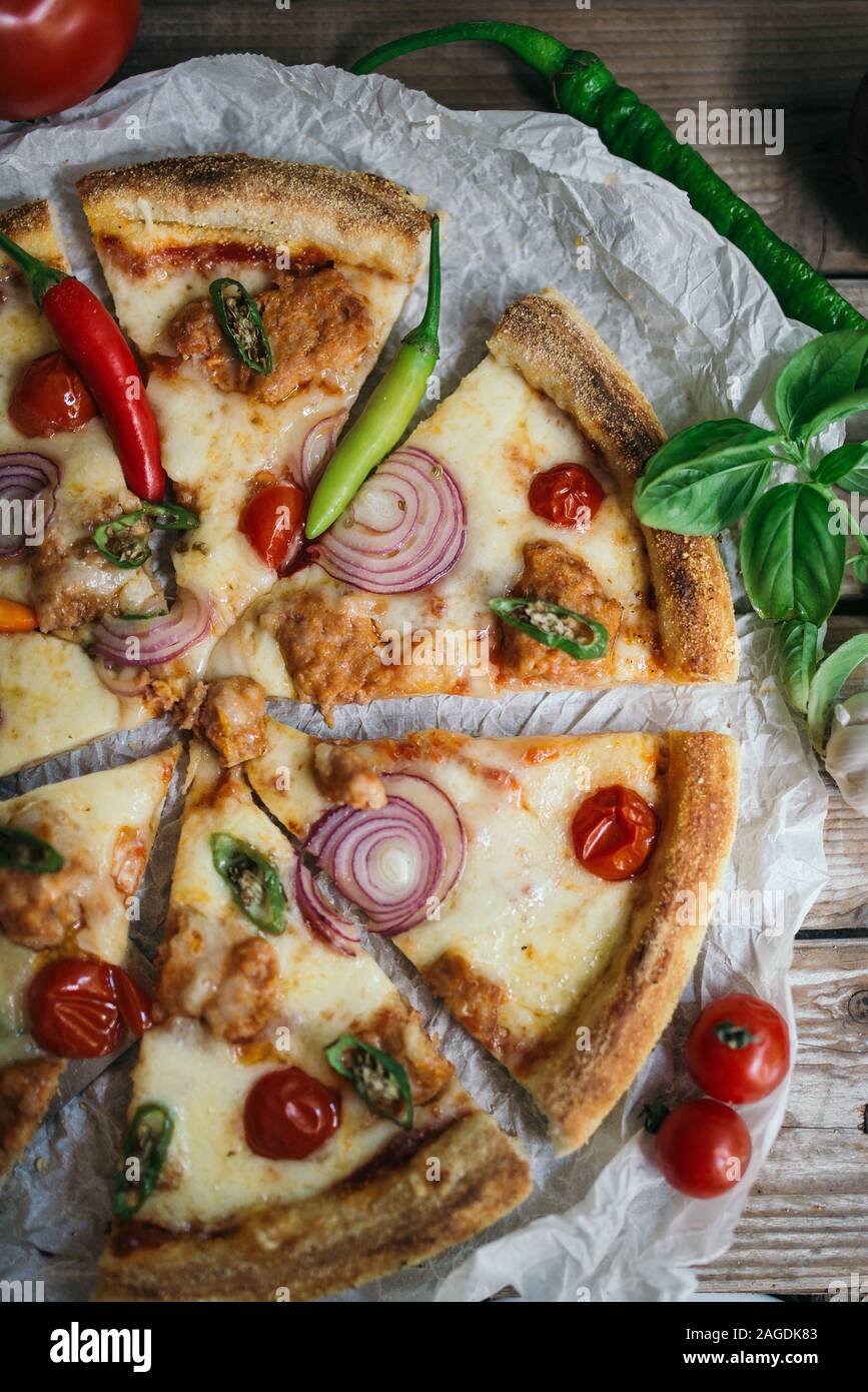 Creative Italian pizza with pepperoni and cherry decoration Stock Photo ...