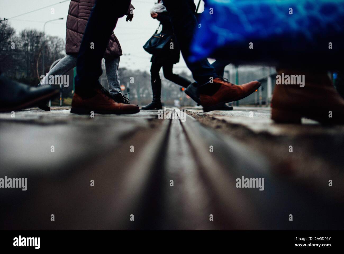 Low angle shot of a group of people walking on the street Stock Photo - Alamy