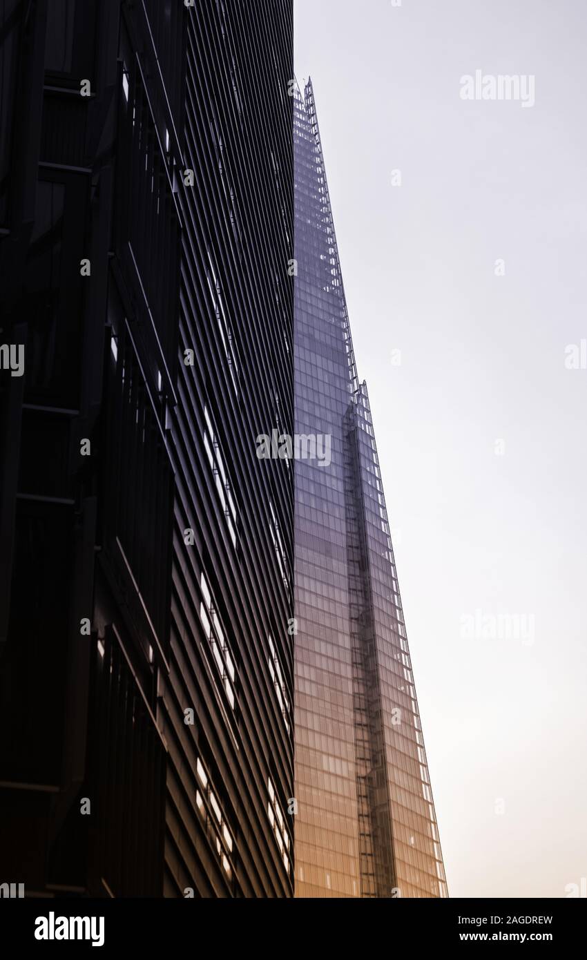 Vertical low angle shot of a high rise building in a glass facade under ...