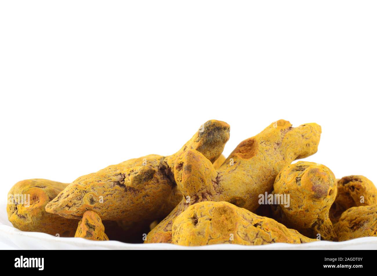 Dry Turmeric roots or barks isolated on white background Stock Photo ...
